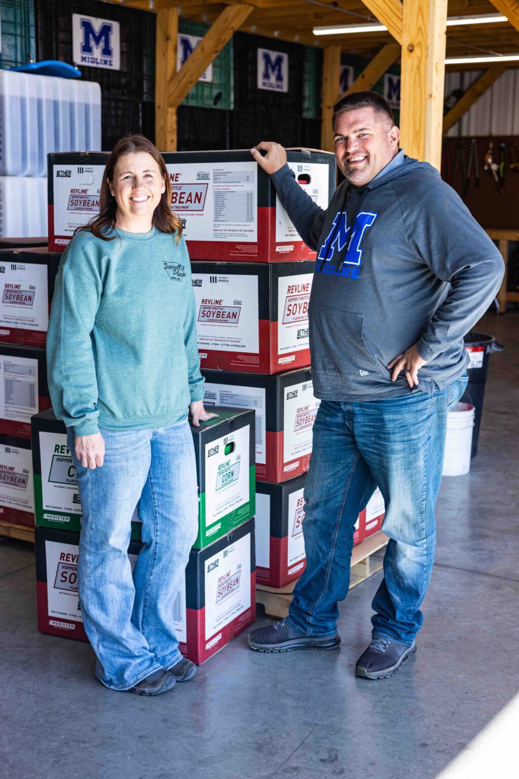 Karrie and John Tiarks of Midline, LLC pause together in the midst of a ...